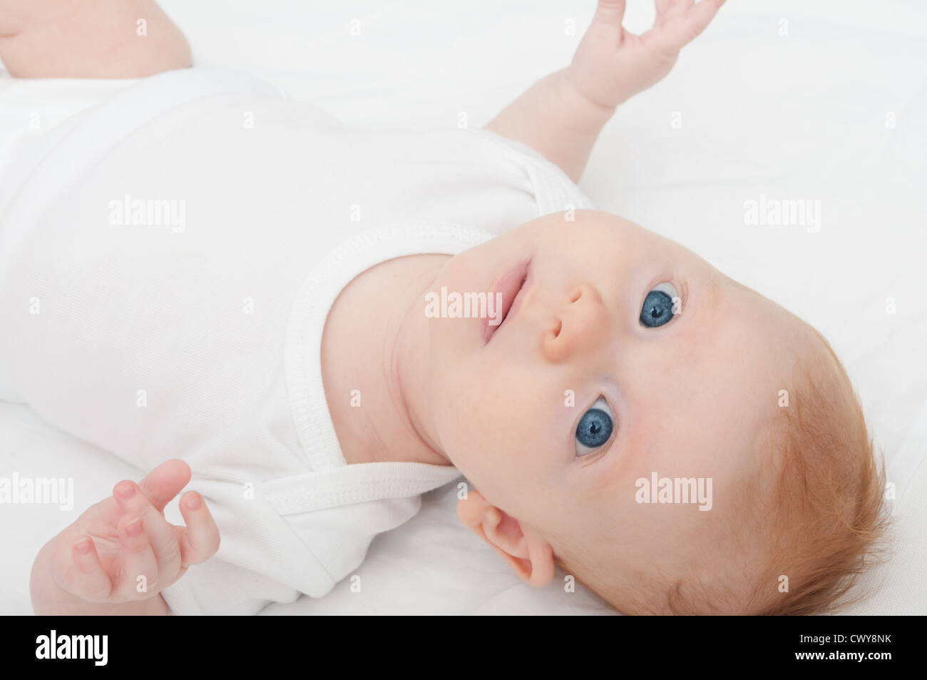 Newborn Baby Lying on Back on White Background Stock Photo - Alamy
