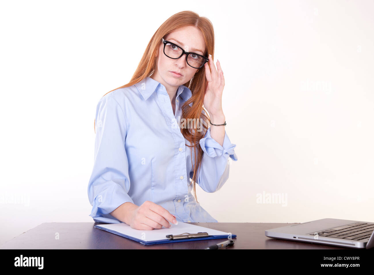 Portrait of a young attractive female secretary working Stock Photo - Alamy
