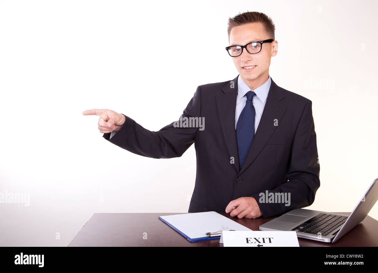 Portrait of a young attractive male secretary with a sign exit Stock ...