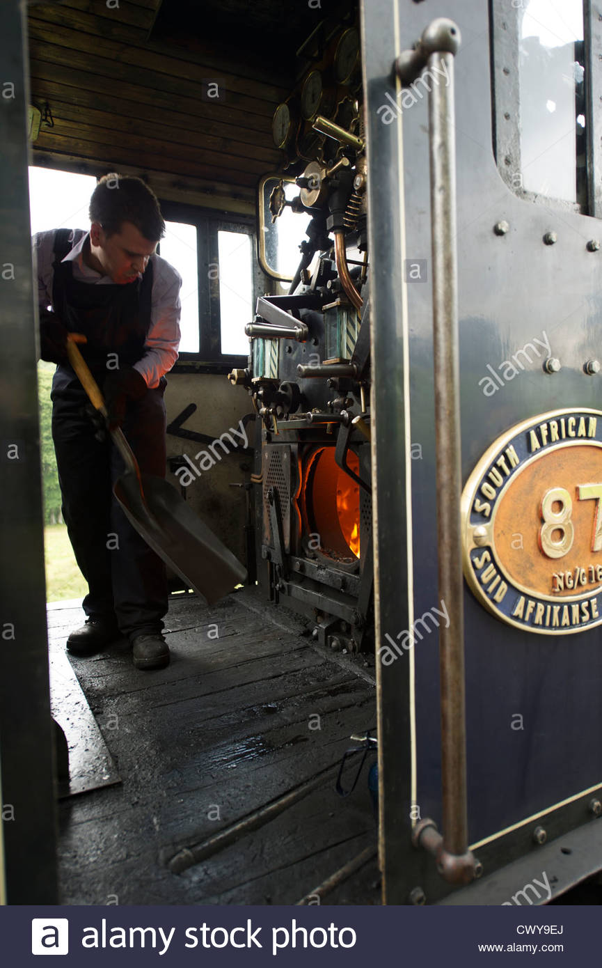 Stoking Fire Stock Photos & Stoking Fire Stock Images - Alamy