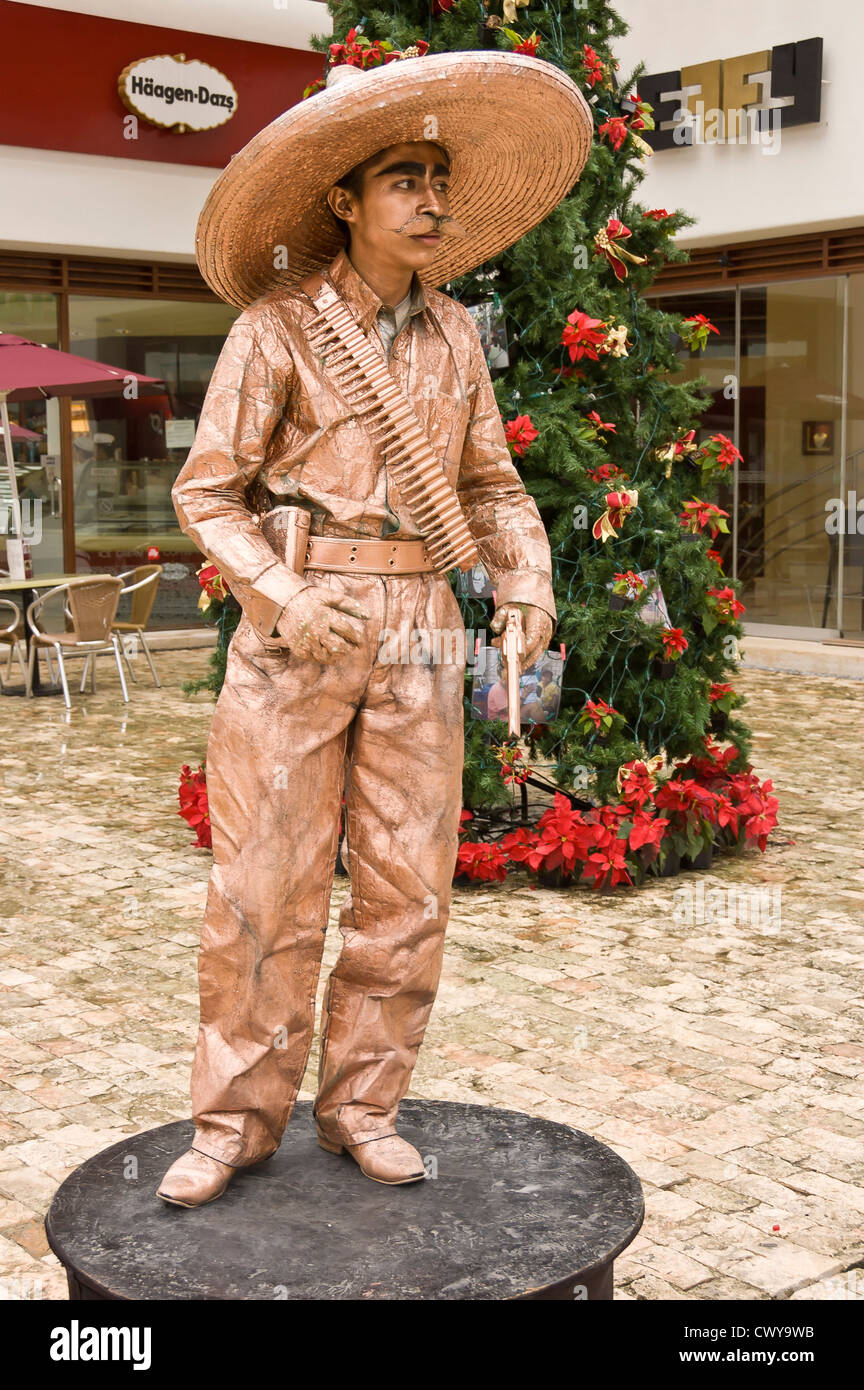 Mexican troll wearing sombrero and guerrilla costume performing in the ...