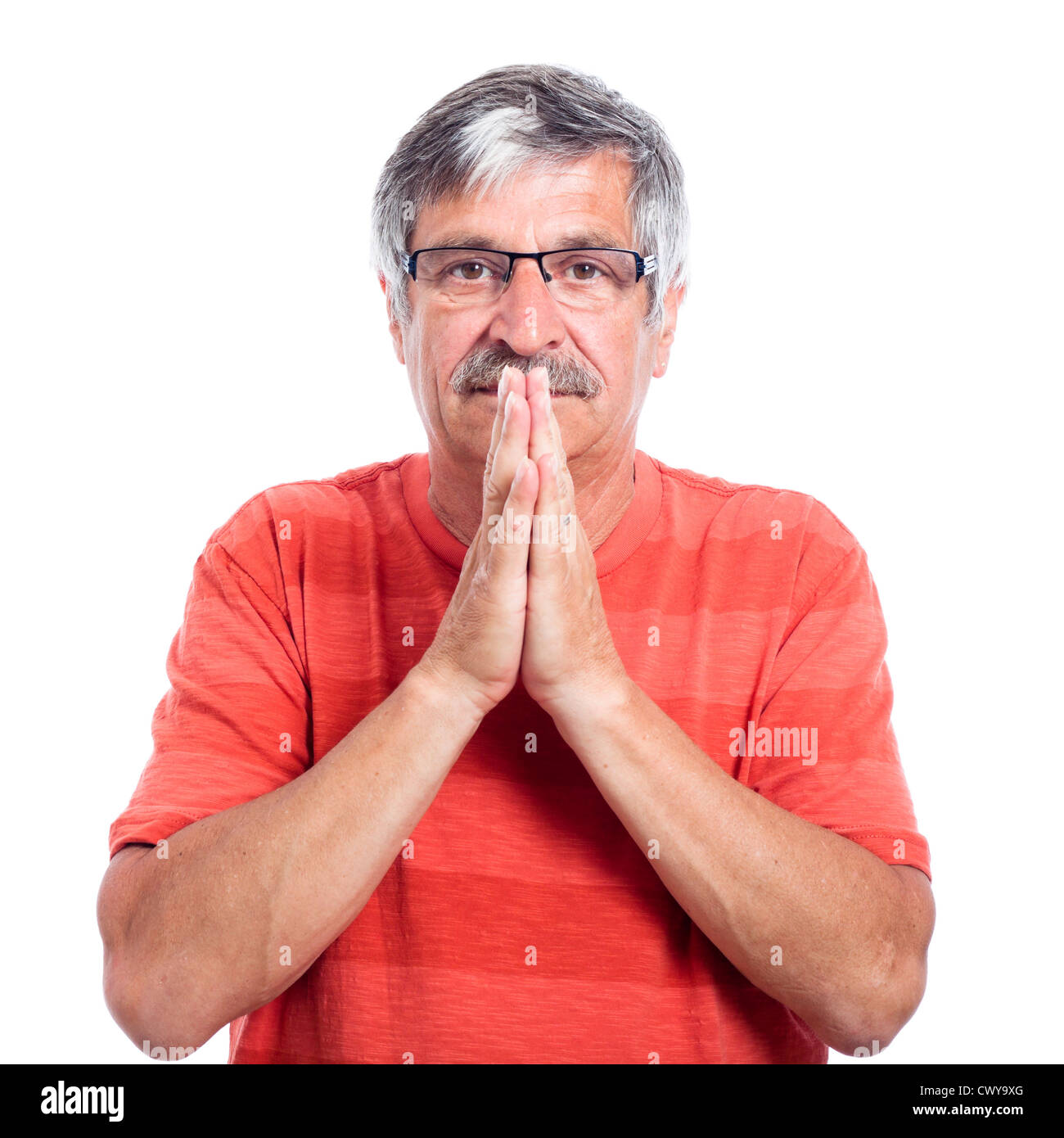Serious senior man praying, isolated on white background Stock Photo ...