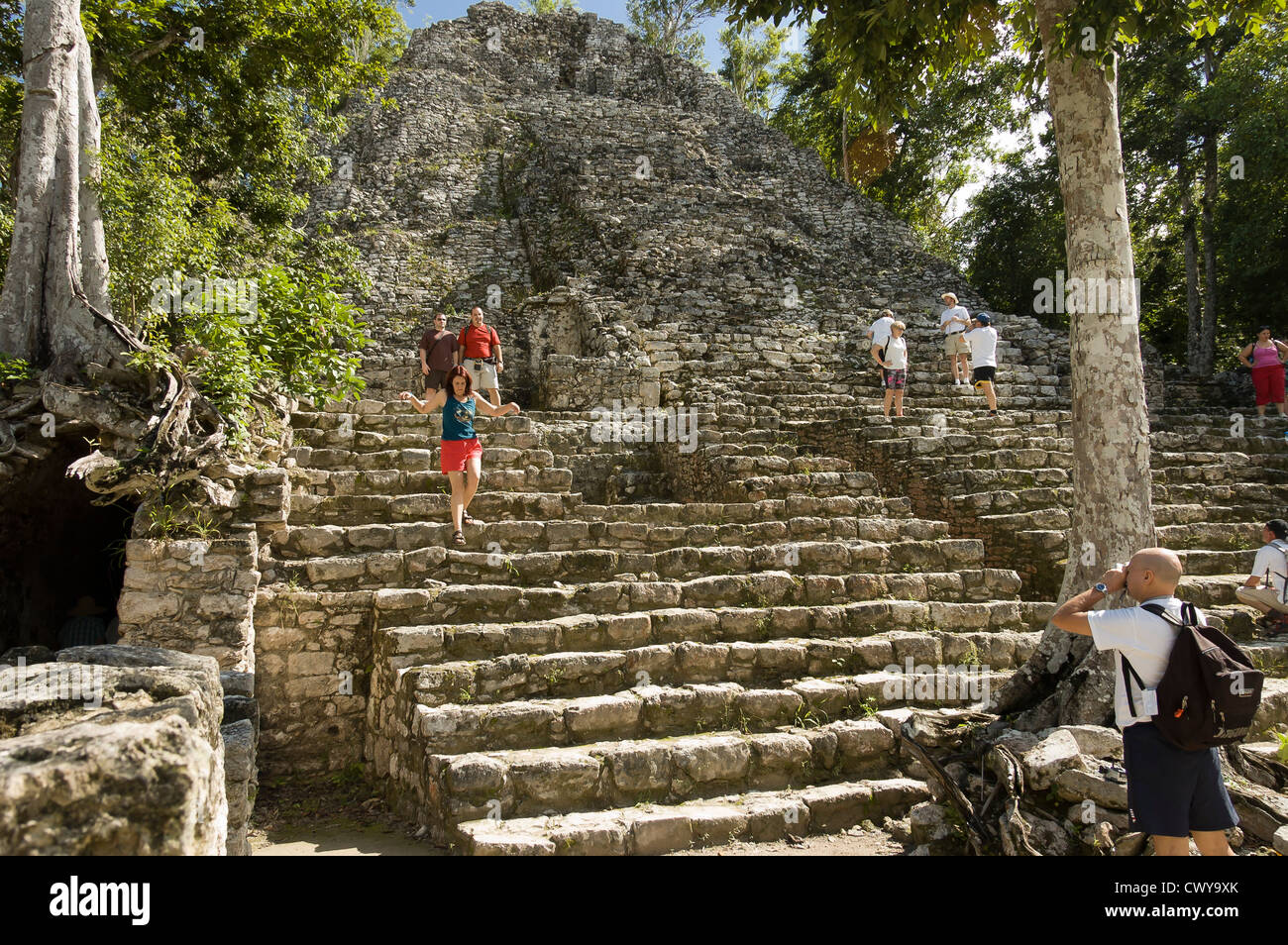 Tourists trying hardly to reach top of the pyramid. The structure known ...