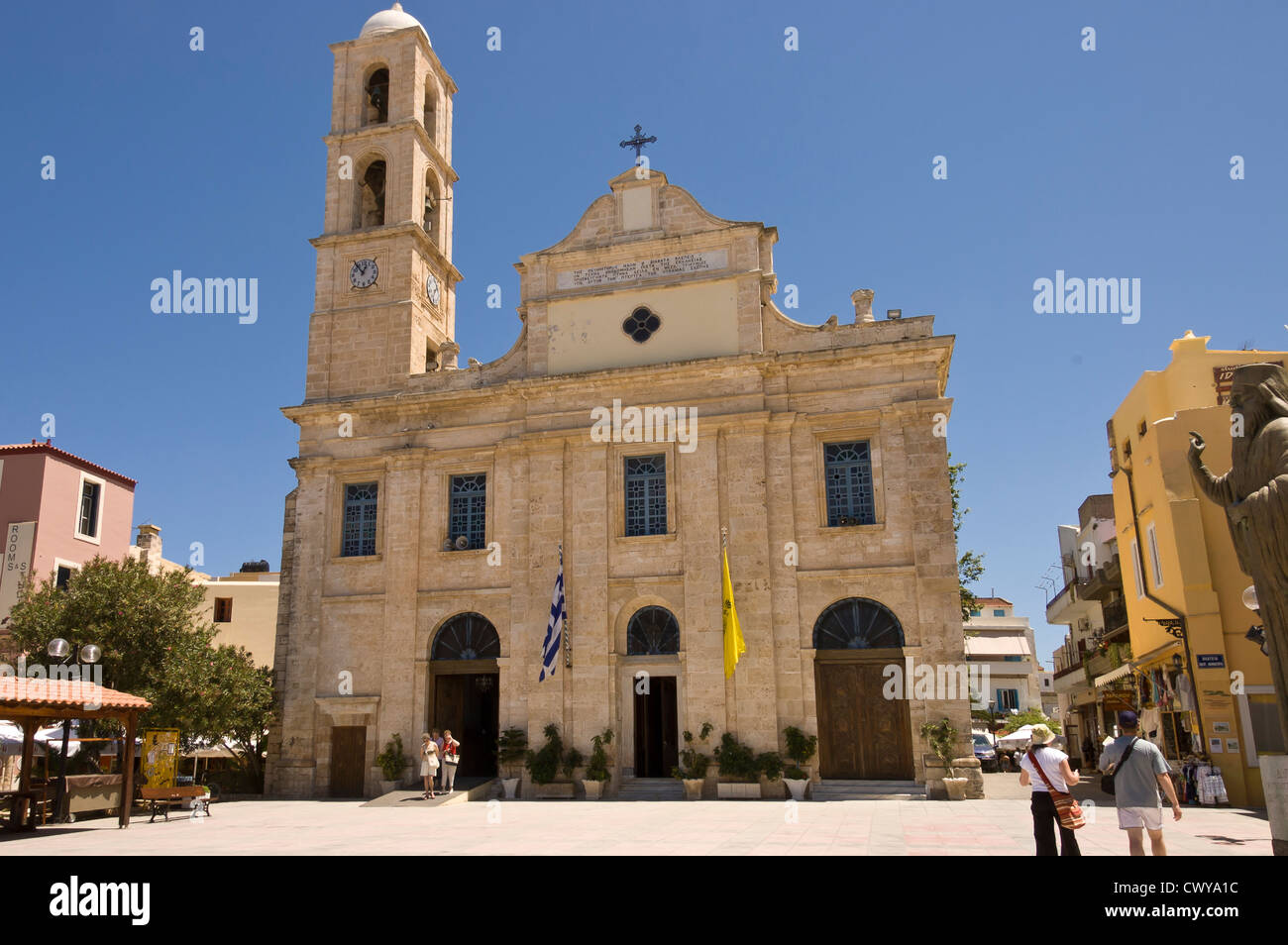 tourists visiting the Greek orthodox church in port of Chania, Crete ...