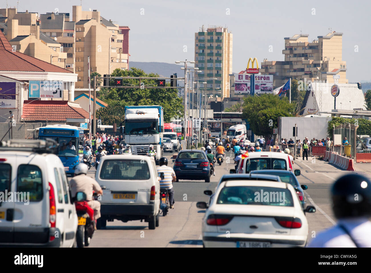 Busy traffic jammed cars crossing Gibraltar Airport runway, frontier ...