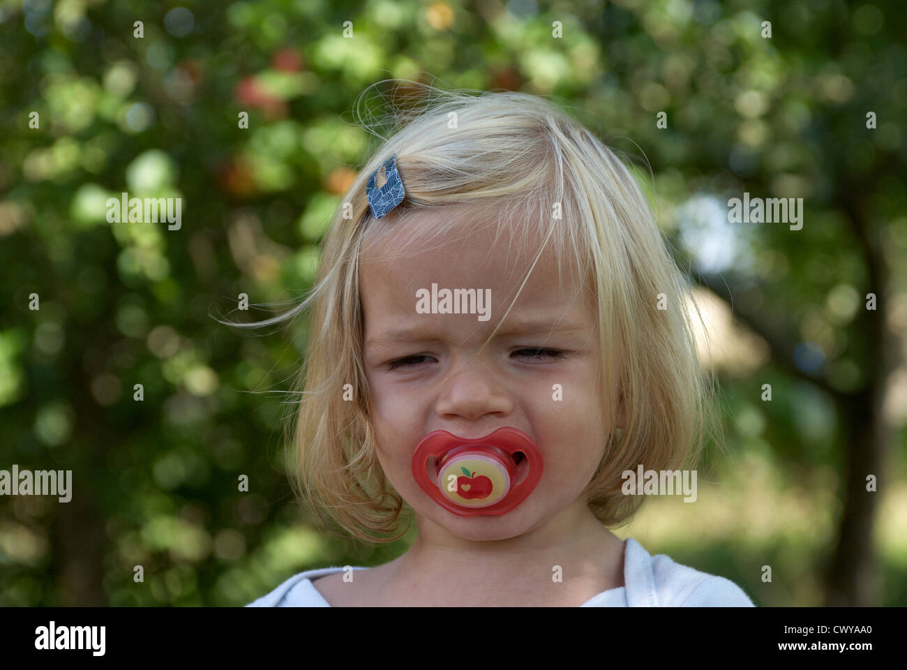 Portrait of toddler blond crying girl outside summer Stock Photo - Alamy