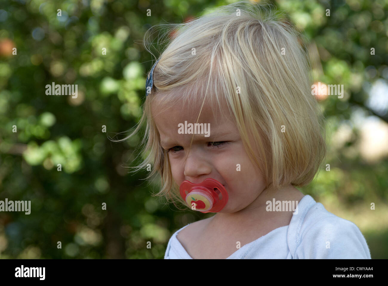 Portrait of toddler blond crying girl outside summer Stock Photo - Alamy