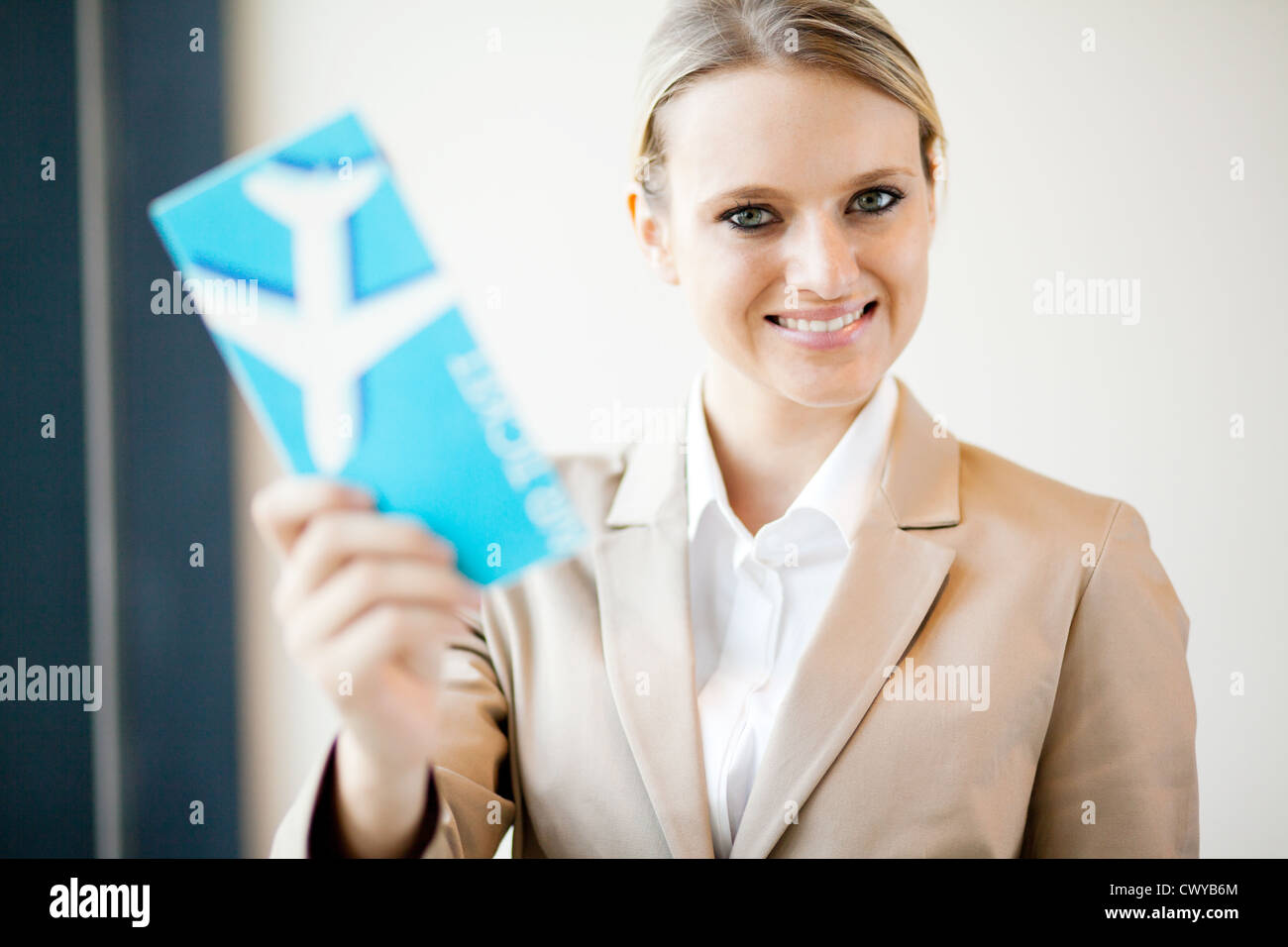 attractive young businesswoman holding air ticket Stock Photo - Alamy