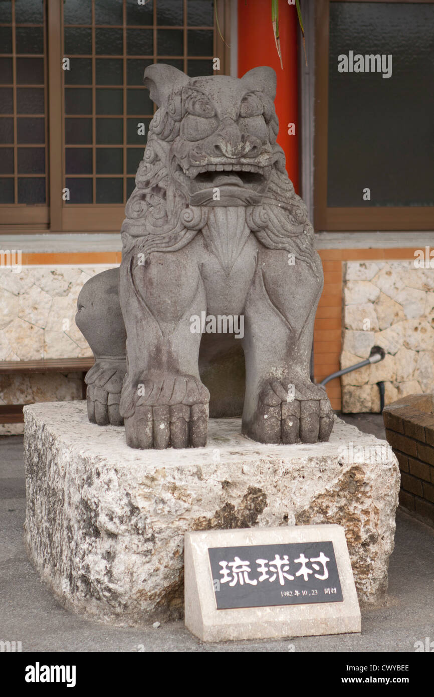 A stone Shiisa lion god at the entrance to the Ryukyu Mura theme park ...
