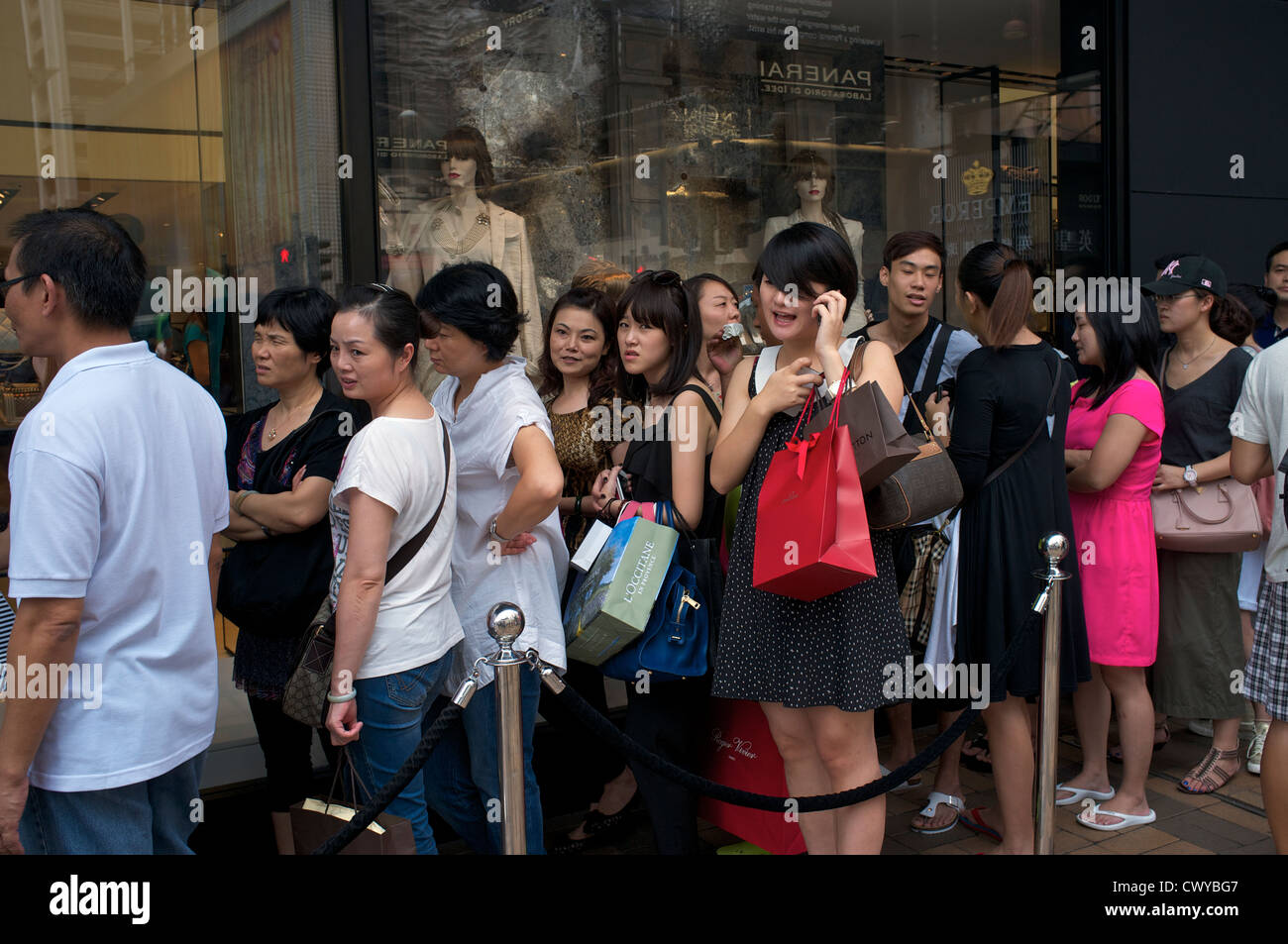 People queue to shop in a CHANEL store in Tsim Sha Tsui, Hong Kong. 28 ...