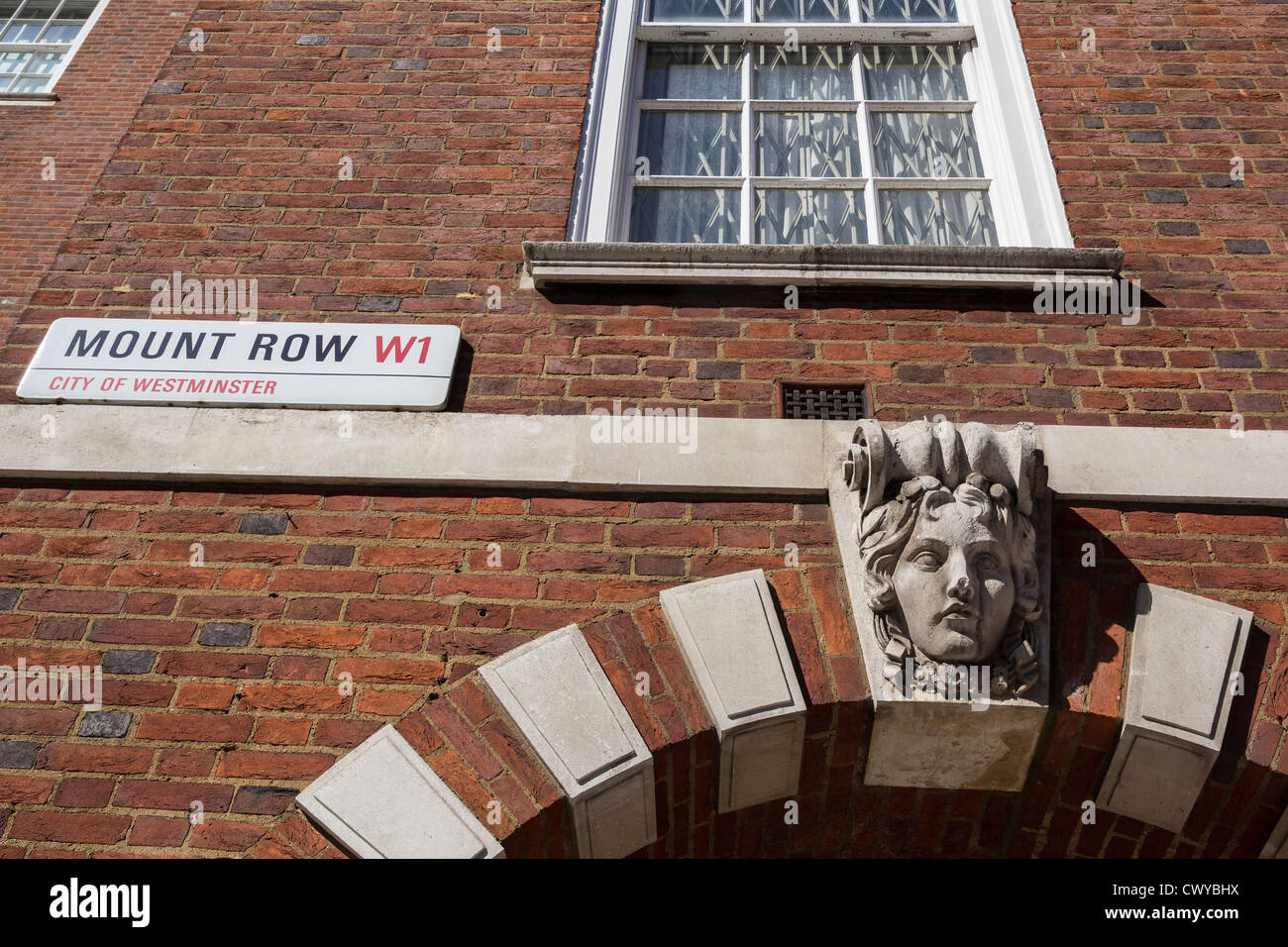 Mount Row street sign and building with sculpted keystone, London ...