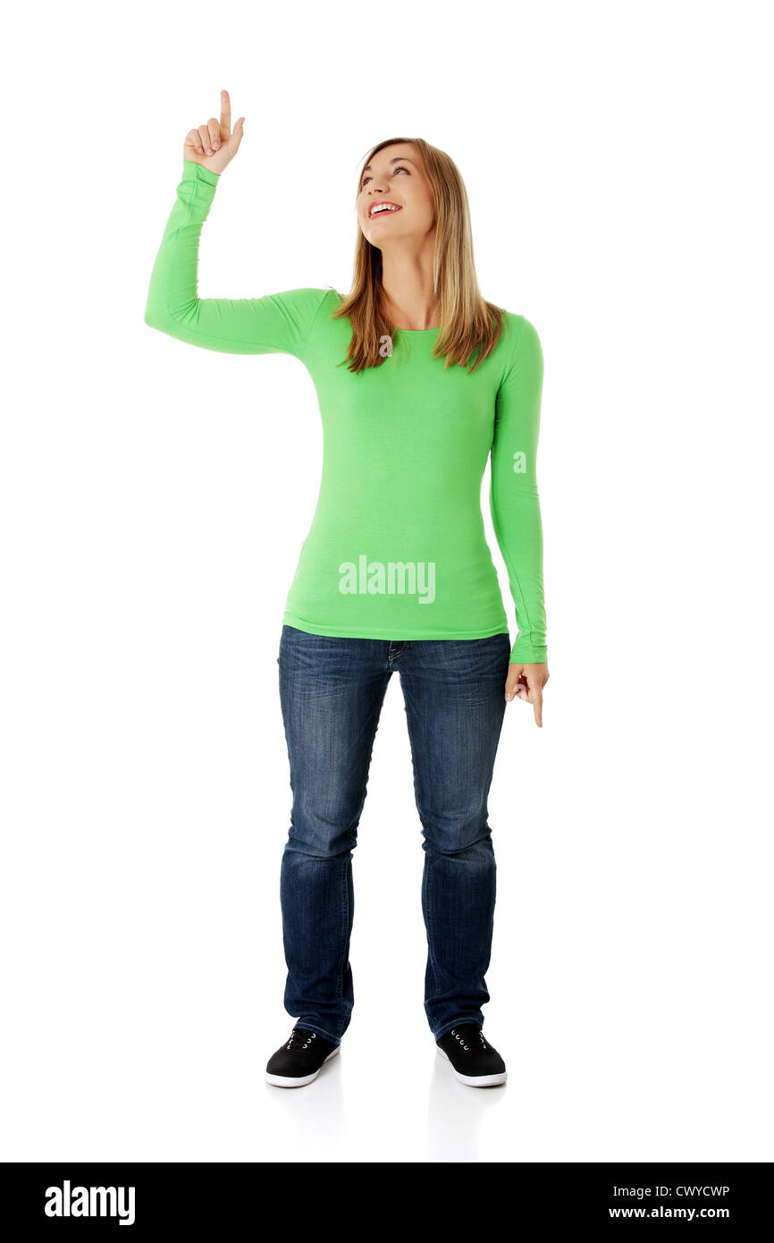 Happy , excited young woman pointing on copy space, isolated on white ...