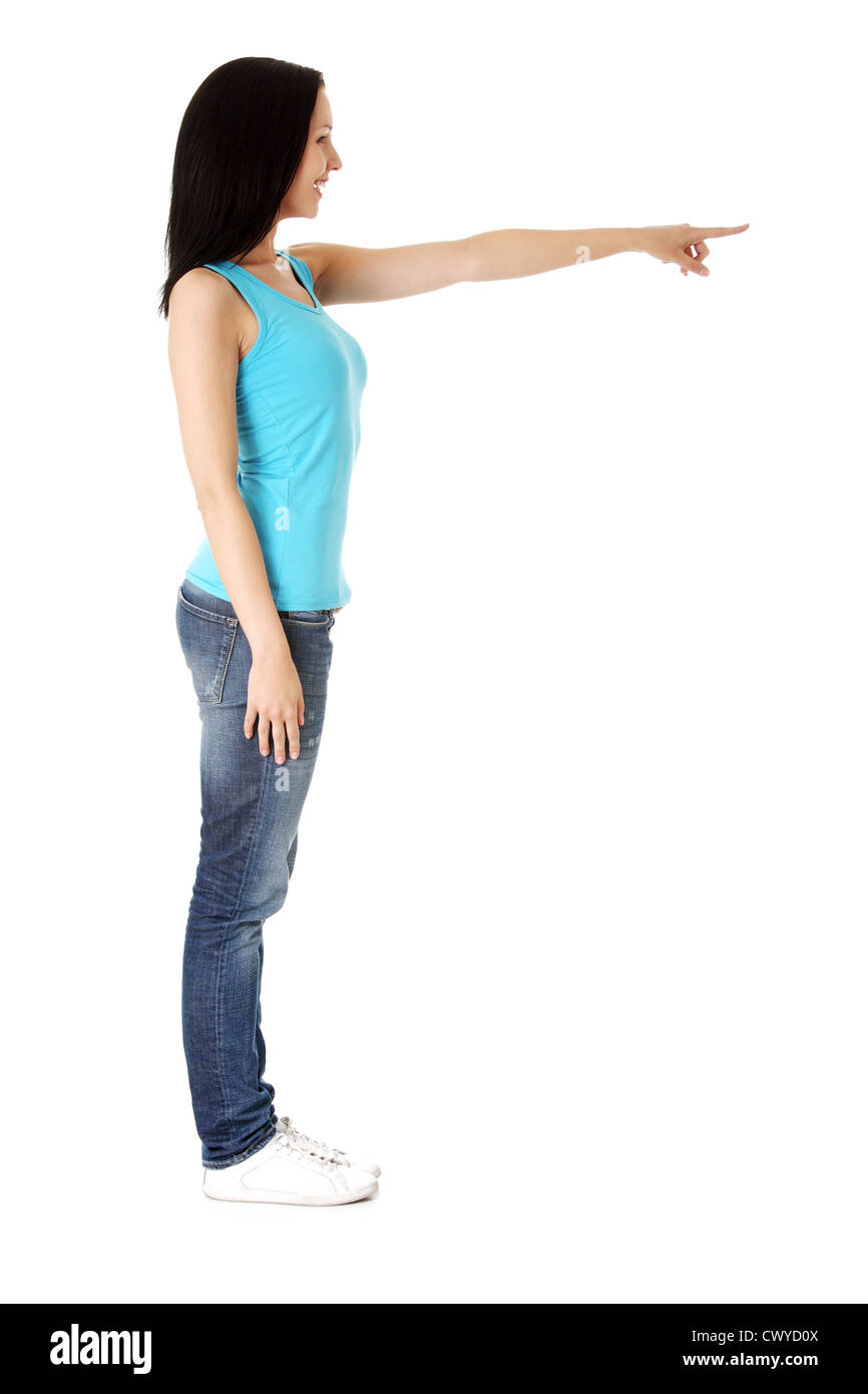 Happy , excited young woman pointing on copy space, isolated on white ...