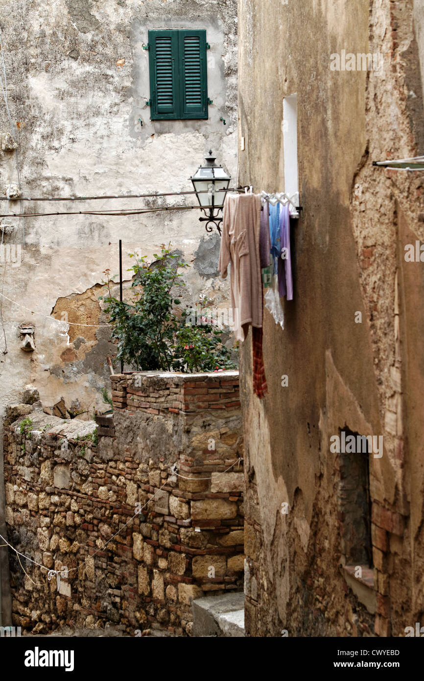 Clothes washing hanging from line in a Italian village,Bibbona Tuscany ...