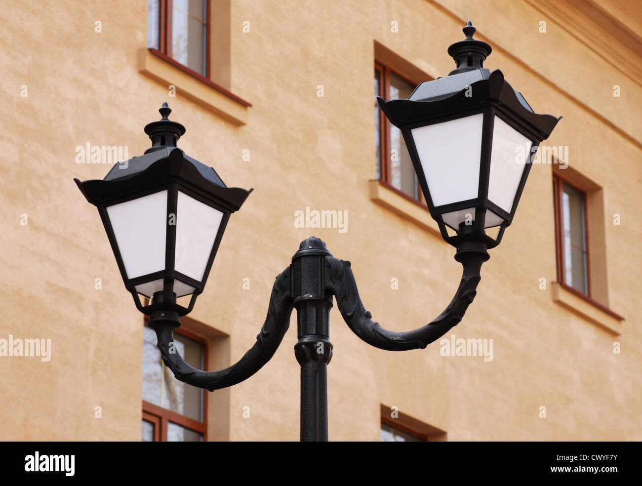 retro fashioned street lamp in front of building Stock Photo - Alamy