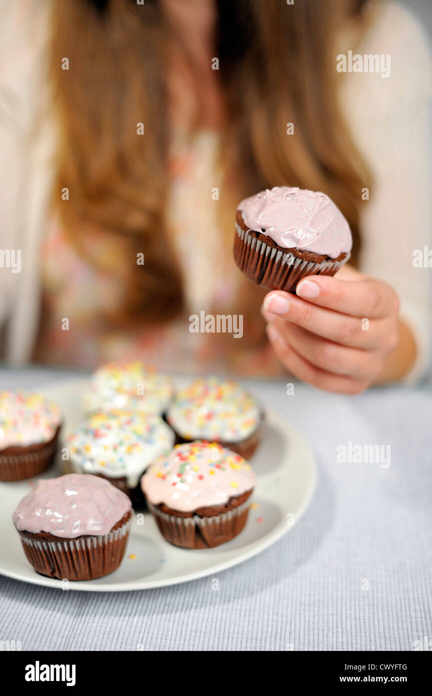 Human hands holding muffin hi-res stock photography and images - Alamy