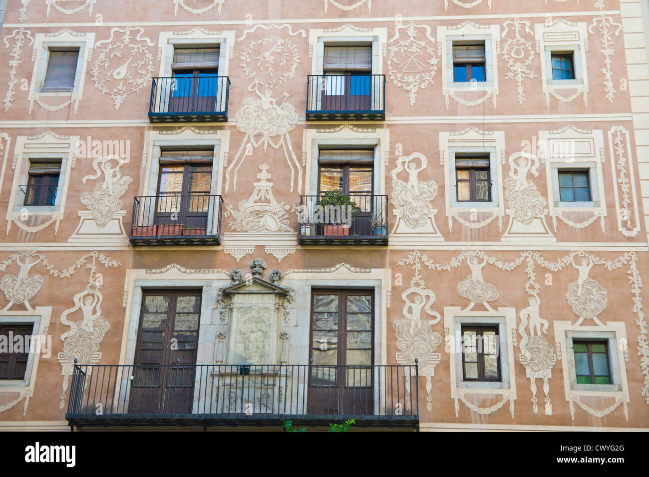 Apartment building with wrought iron balconies & elaborate decoration ...