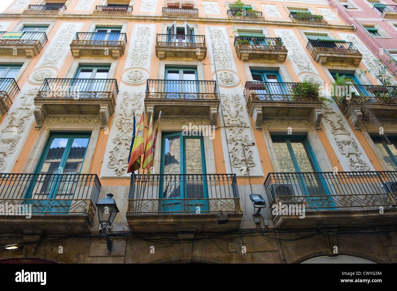 Apartment building with wrought iron balconies & elaborate decoration ...