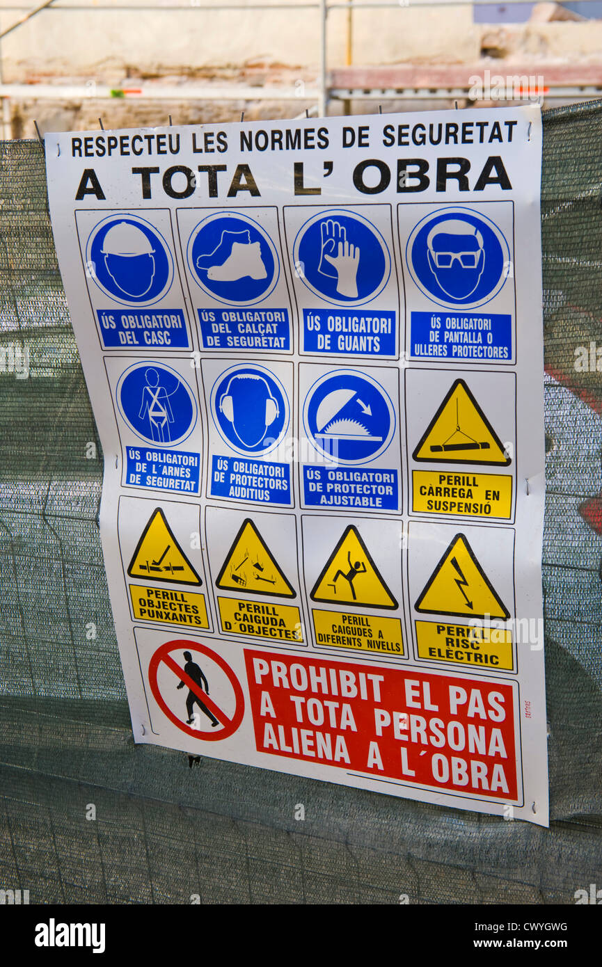Spanish warning sign on security fence of building site in Barcelona ...