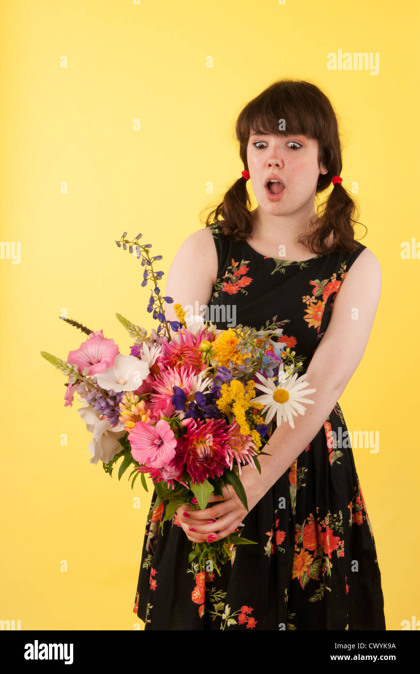 Young woman is surprised with bouquet colorful garden flowers Stock ...