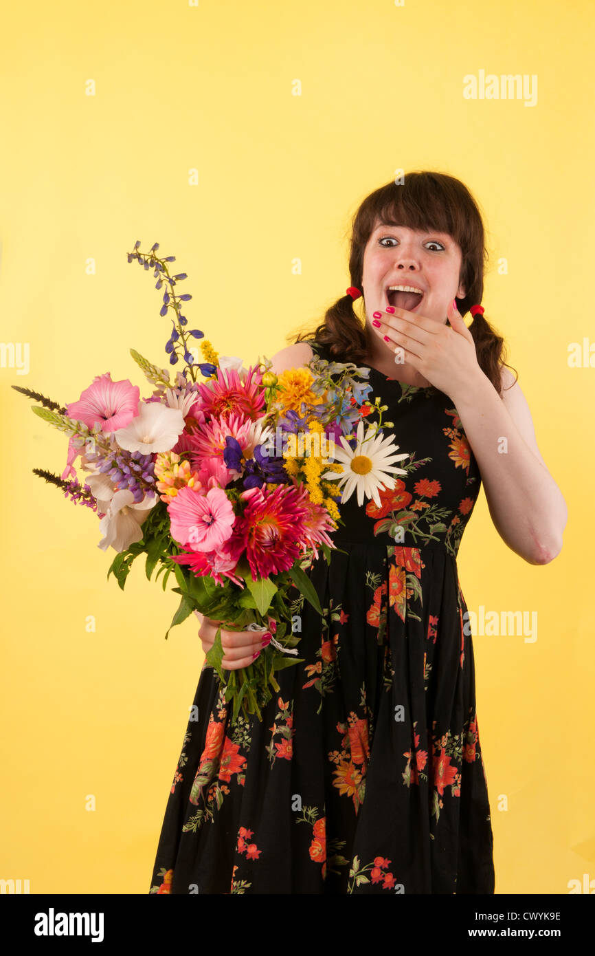 Young woman is happy with bouquet colorful garden flowers Stock Photo ...