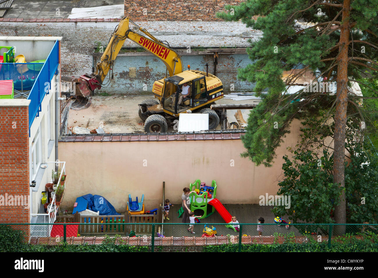 demolition next to creche danger hazard children Stock Photo - Alamy