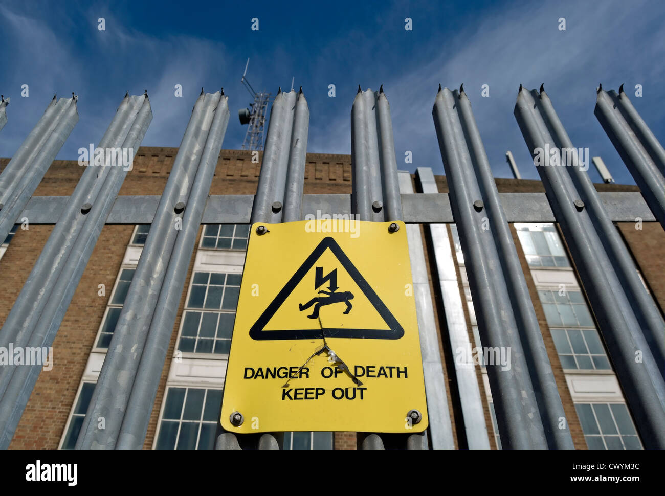 danger of death keep out sign on railings at an electricity substation ...