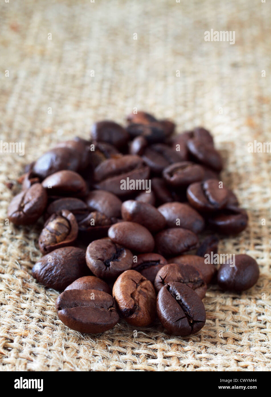 Coffee beans over rustic background Stock Photo - Alamy