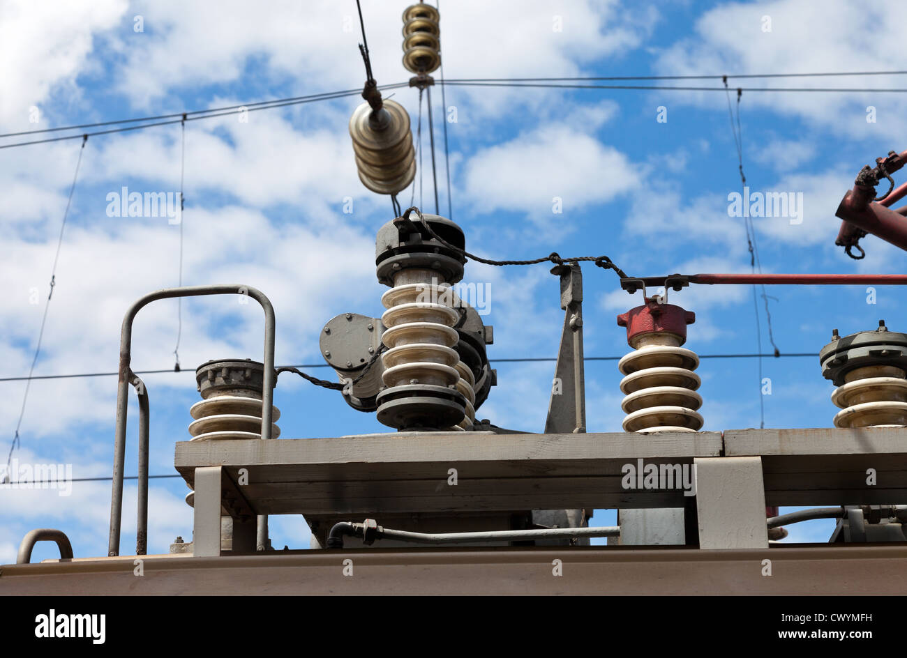 Railroad overhead lines against blue sky Stock Photo - Alamy