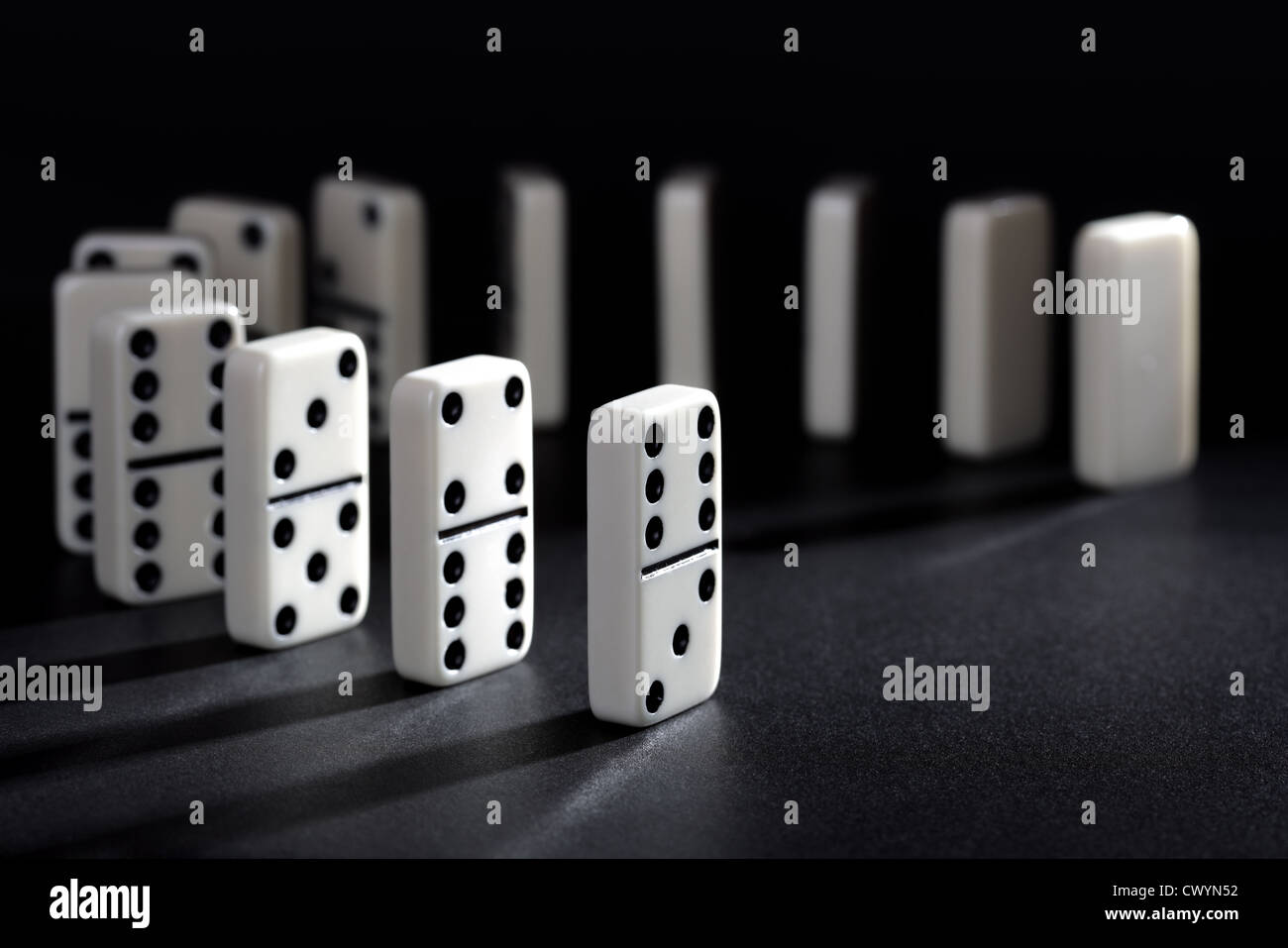 Dominoes falling in row hi-res stock photography and images - Alamy