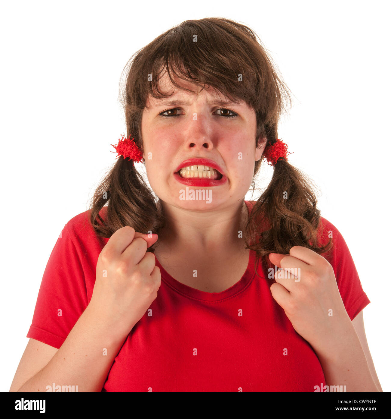 Portrait of an angry young teen girl in red Stock Photo - Alamy