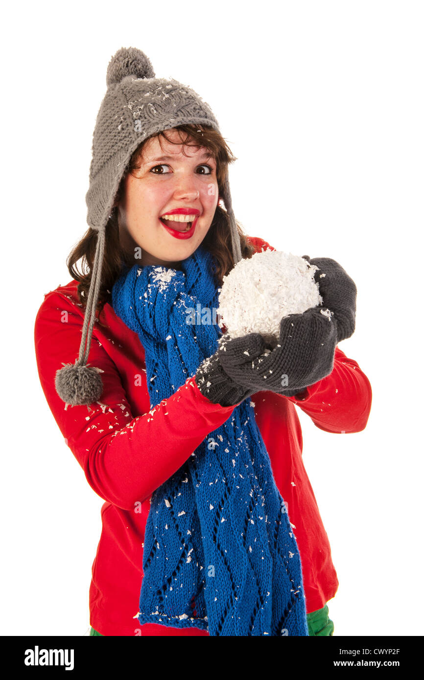 Winter girl in red and blue is throwing snow ball Stock Photo - Alamy