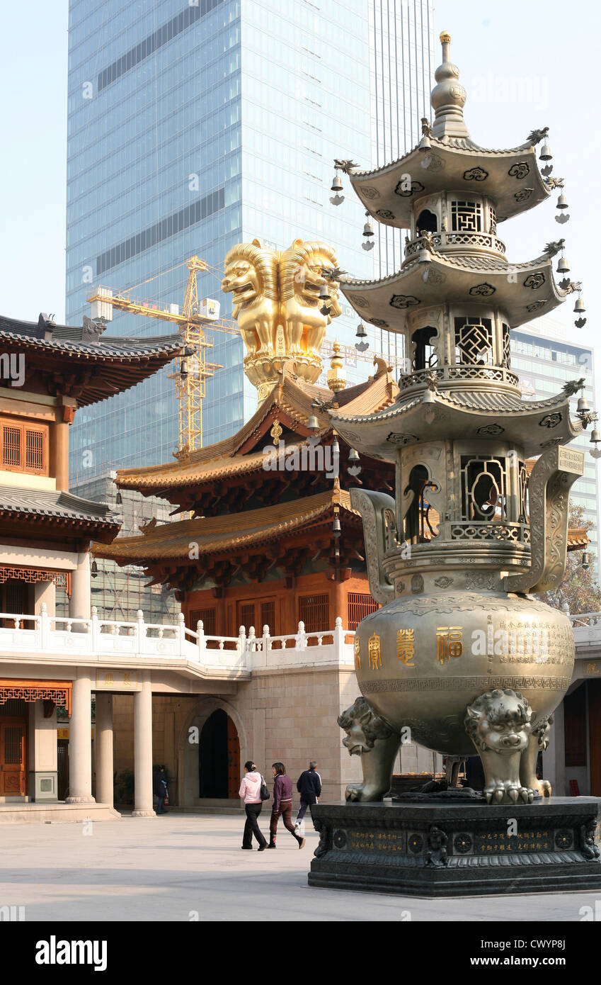 Historical pagoda in front of modern skyscraper in Shanghai, China ...