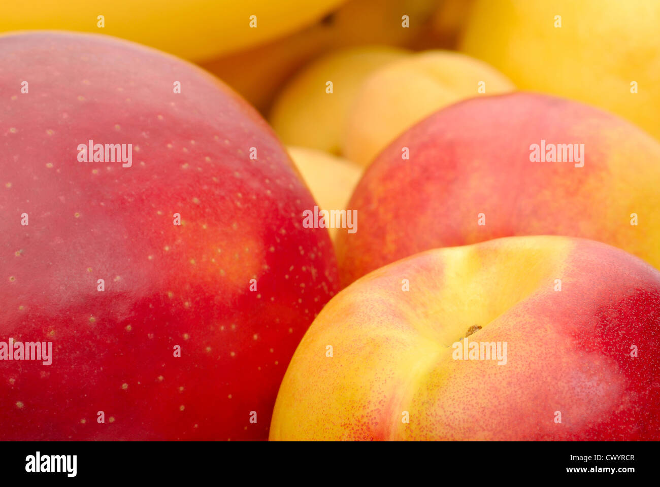 red and yellow background of fresh fruits Stock Photo - Alamy