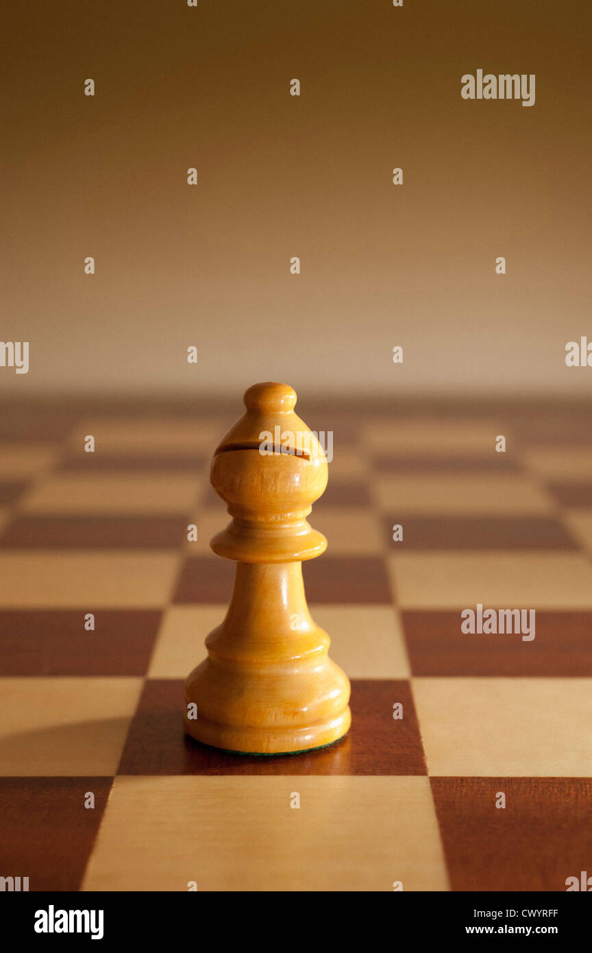 white chess bishop on a chessboard Stock Photo - Alamy