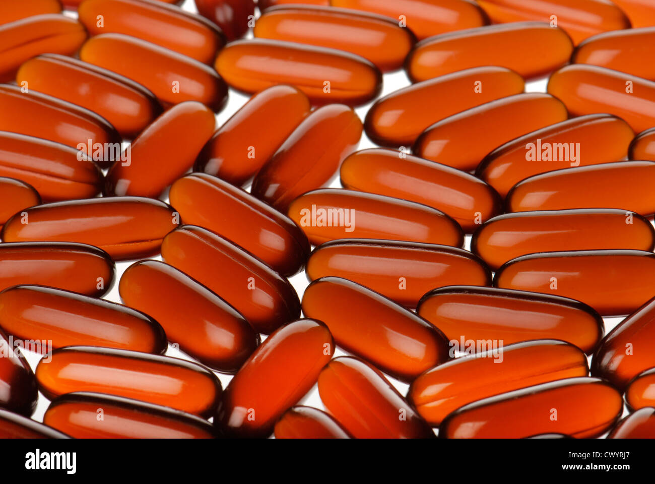 closeup bright orange capsules background Stock Photo - Alamy