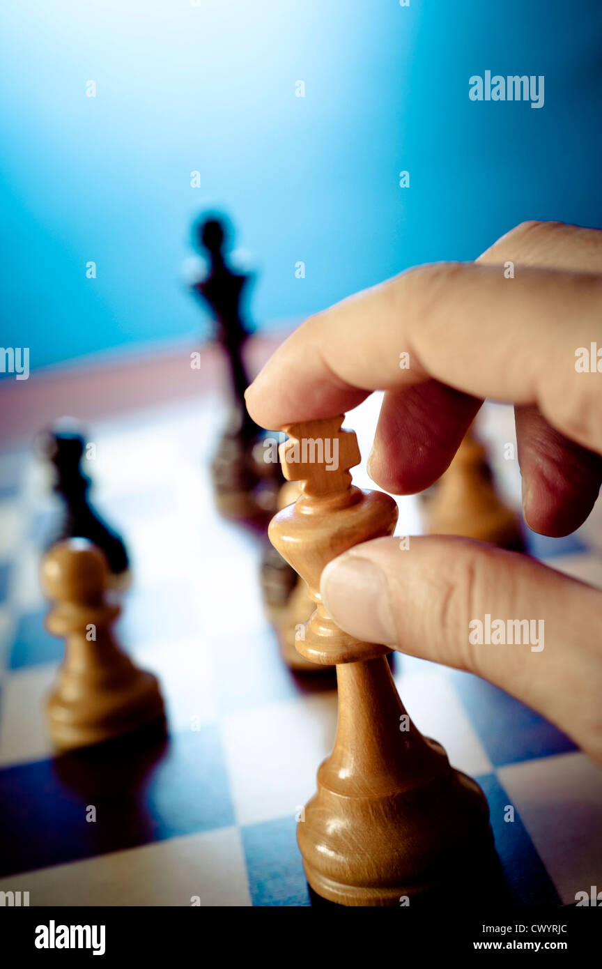 playing a chess king move Stock Photo - Alamy