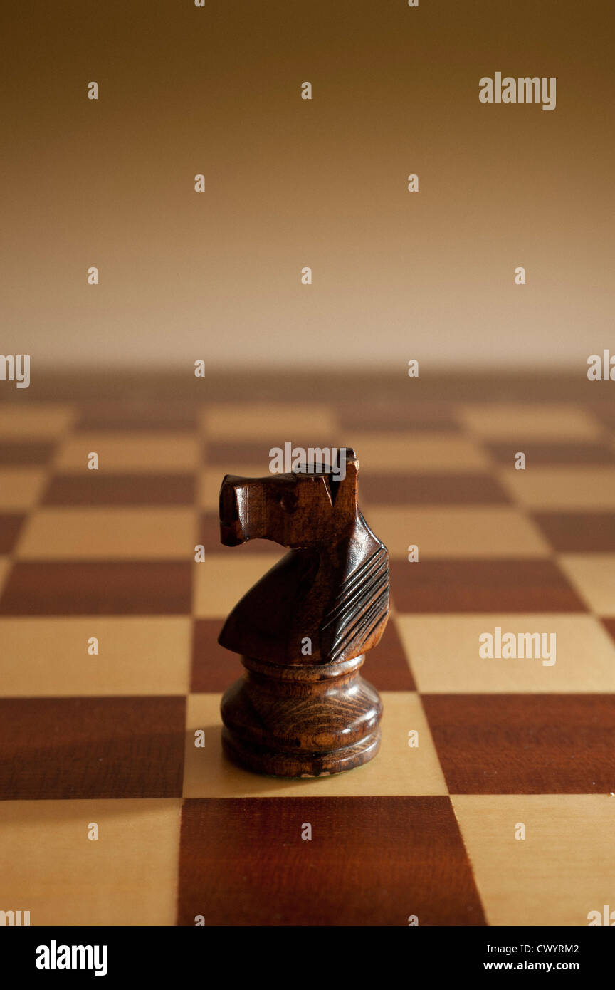 black chess knight on a chessboard Stock Photo - Alamy