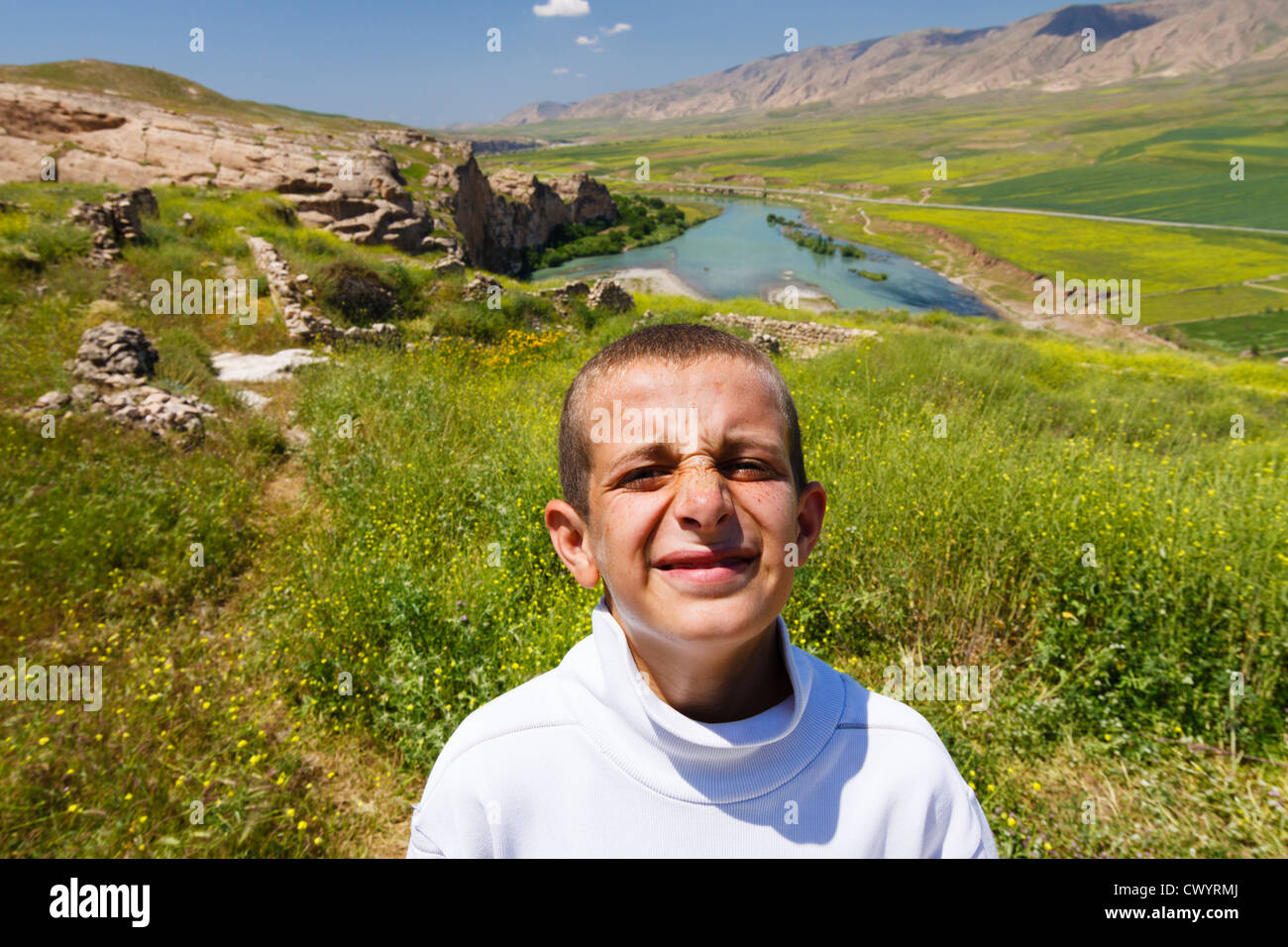 Funny portrait of Kurdish boy in Tigris river landscape , Hasankeyf ...