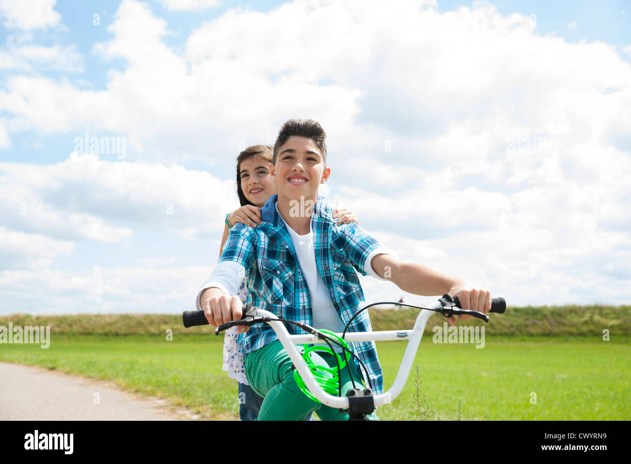 Two kids on bikes Stock Photo - Alamy