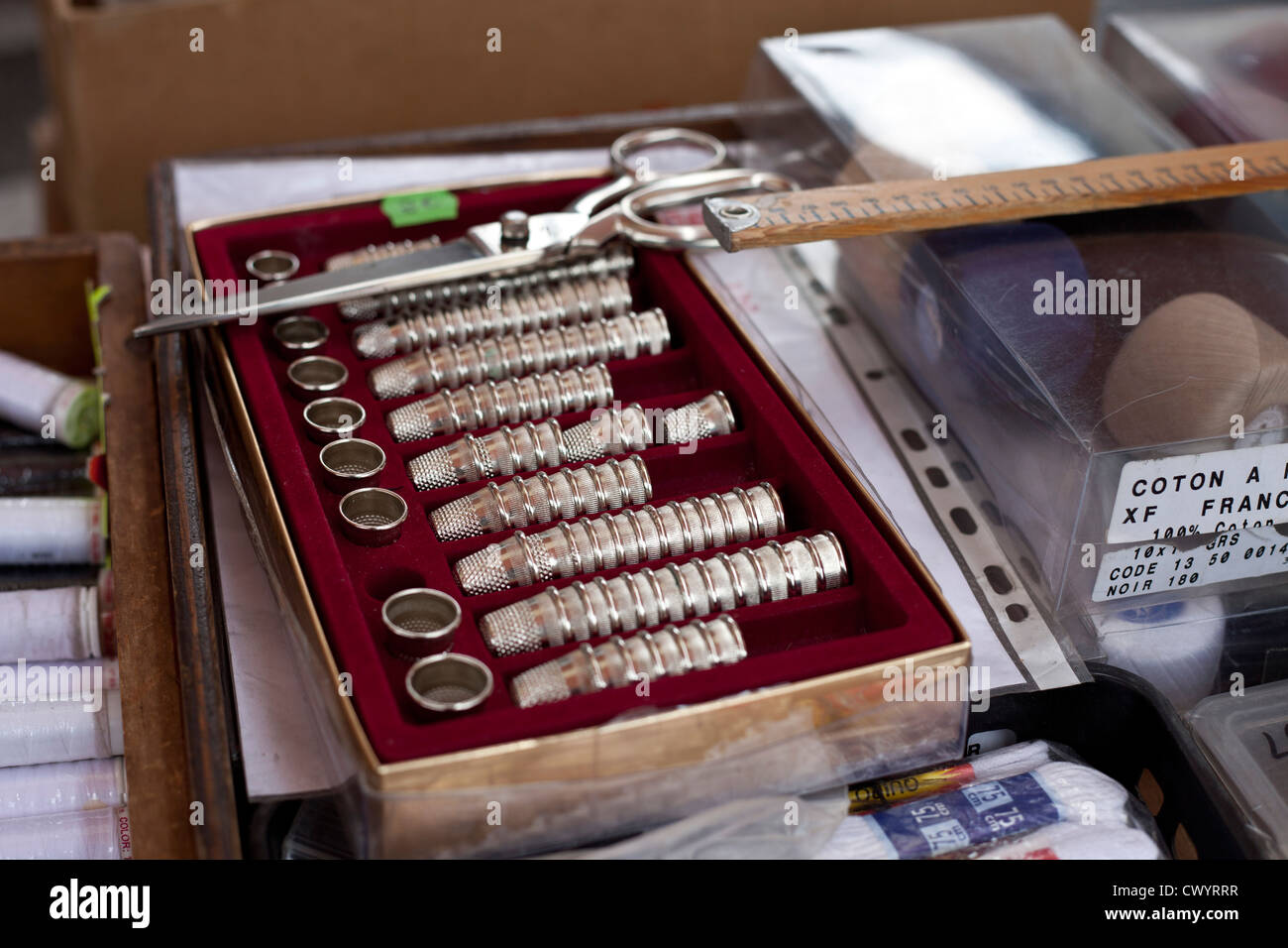 Chrome thimbles on a market stall France Stock Photo - Alamy