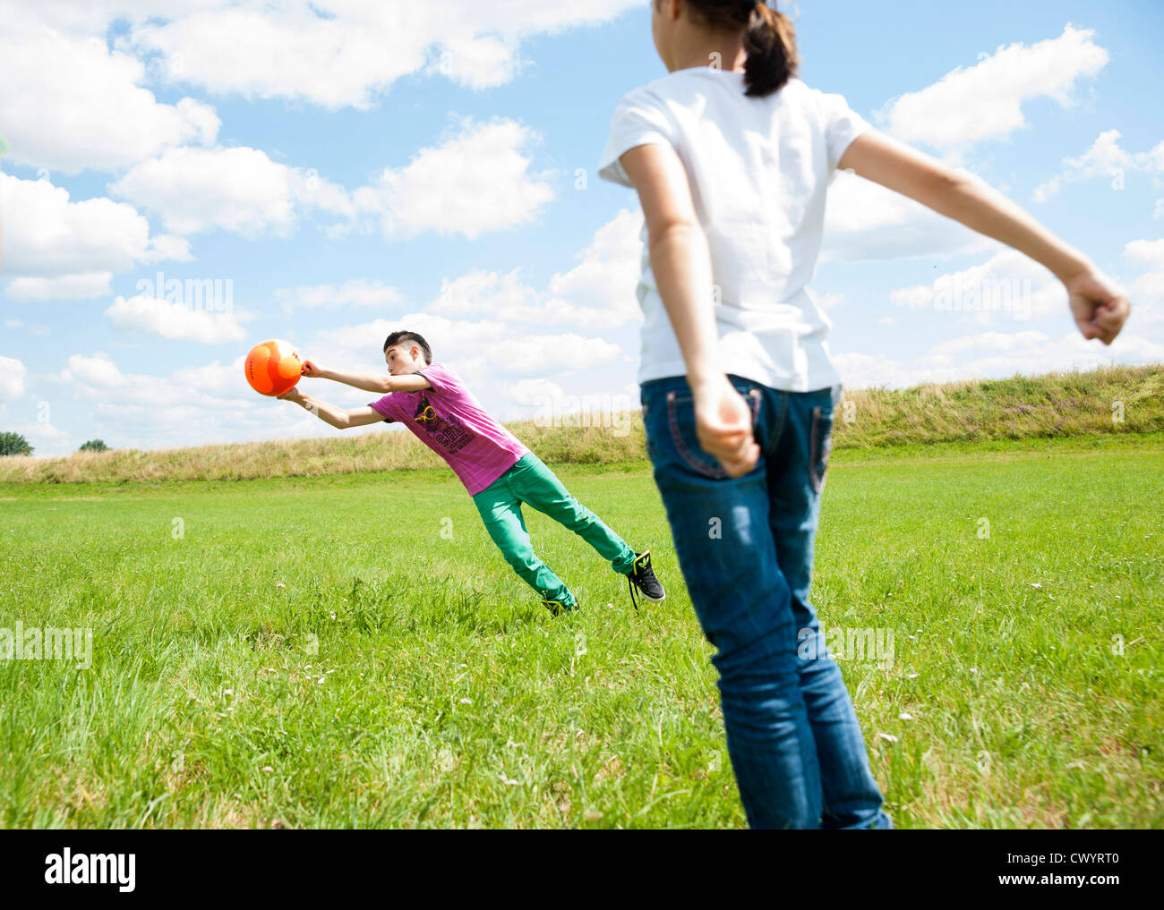 Two kids playing football hi-res stock photography and images - Alamy