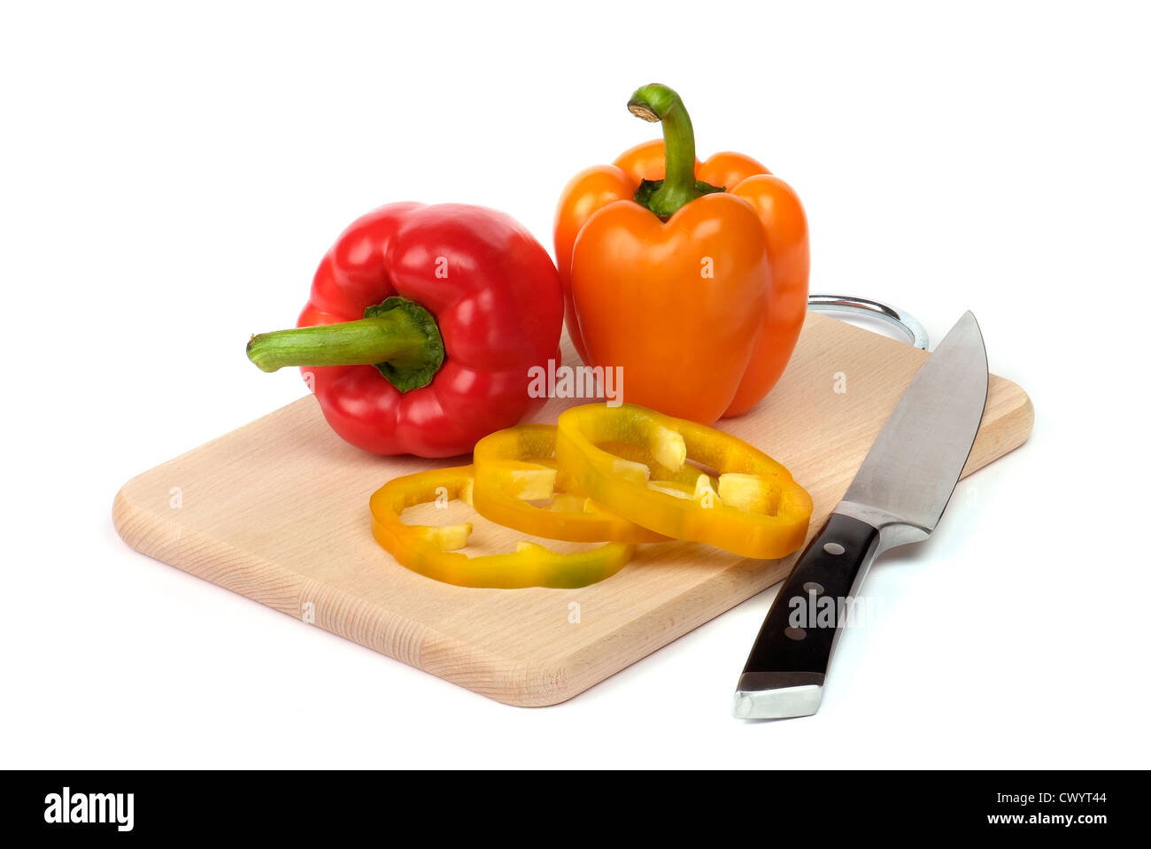 colorful peppers on board isolated on white Stock Photo - Alamy