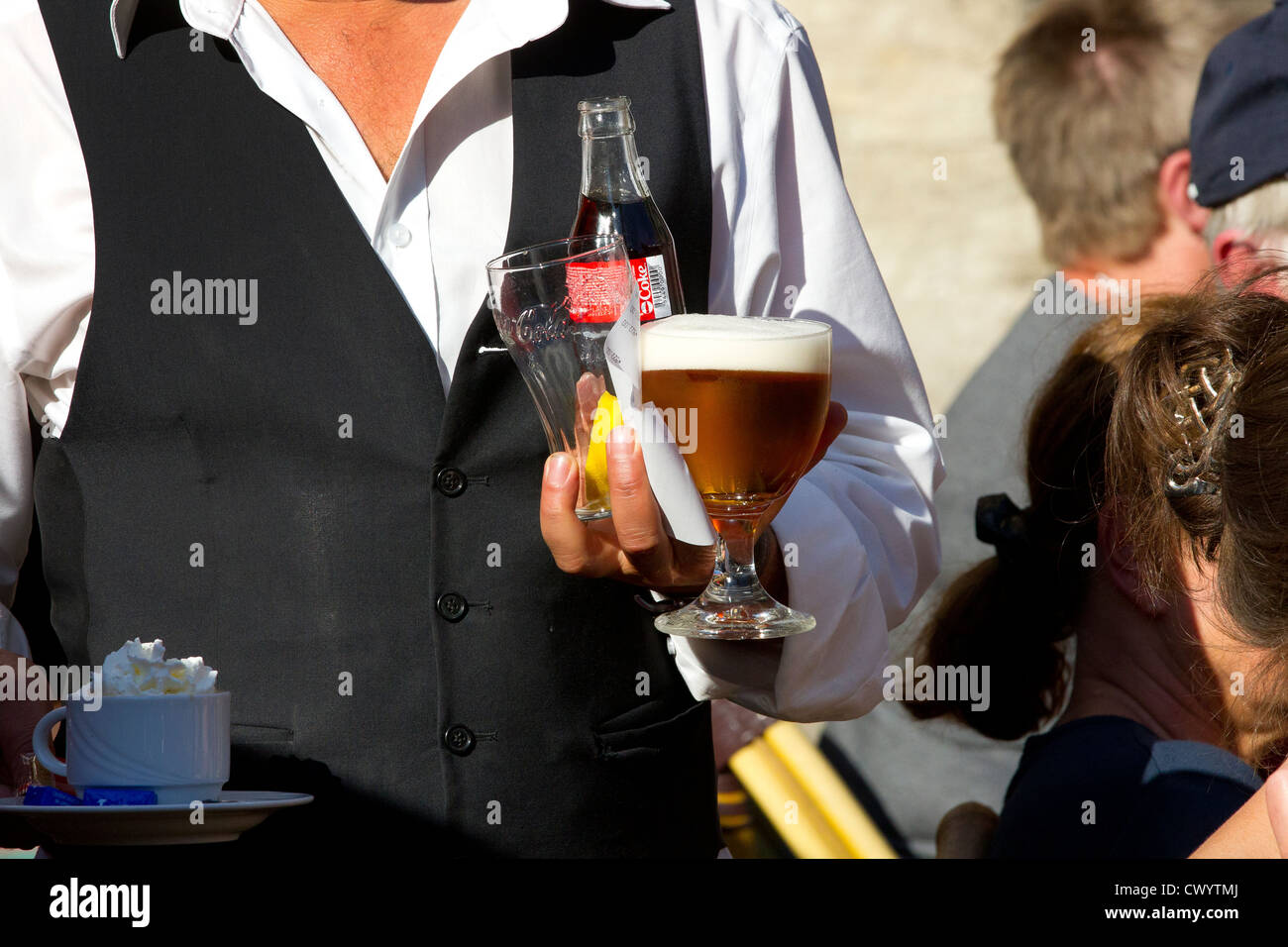 Waiter holding tray beer glass hi-res stock photography and images - Alamy