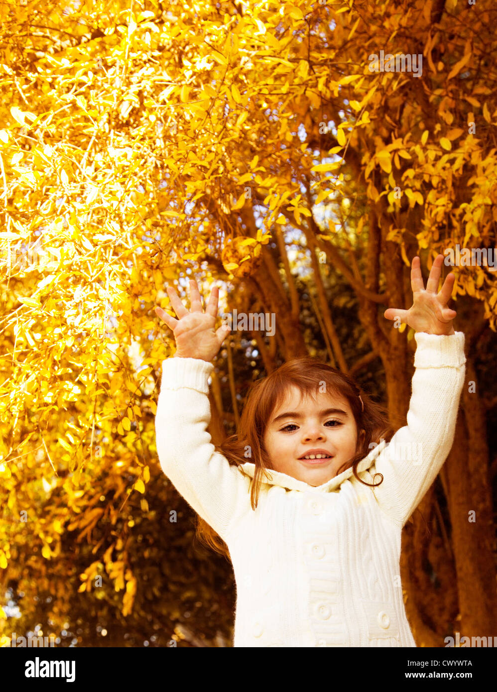 Image of adorable small girl play game on backyard in fall, candid ...
