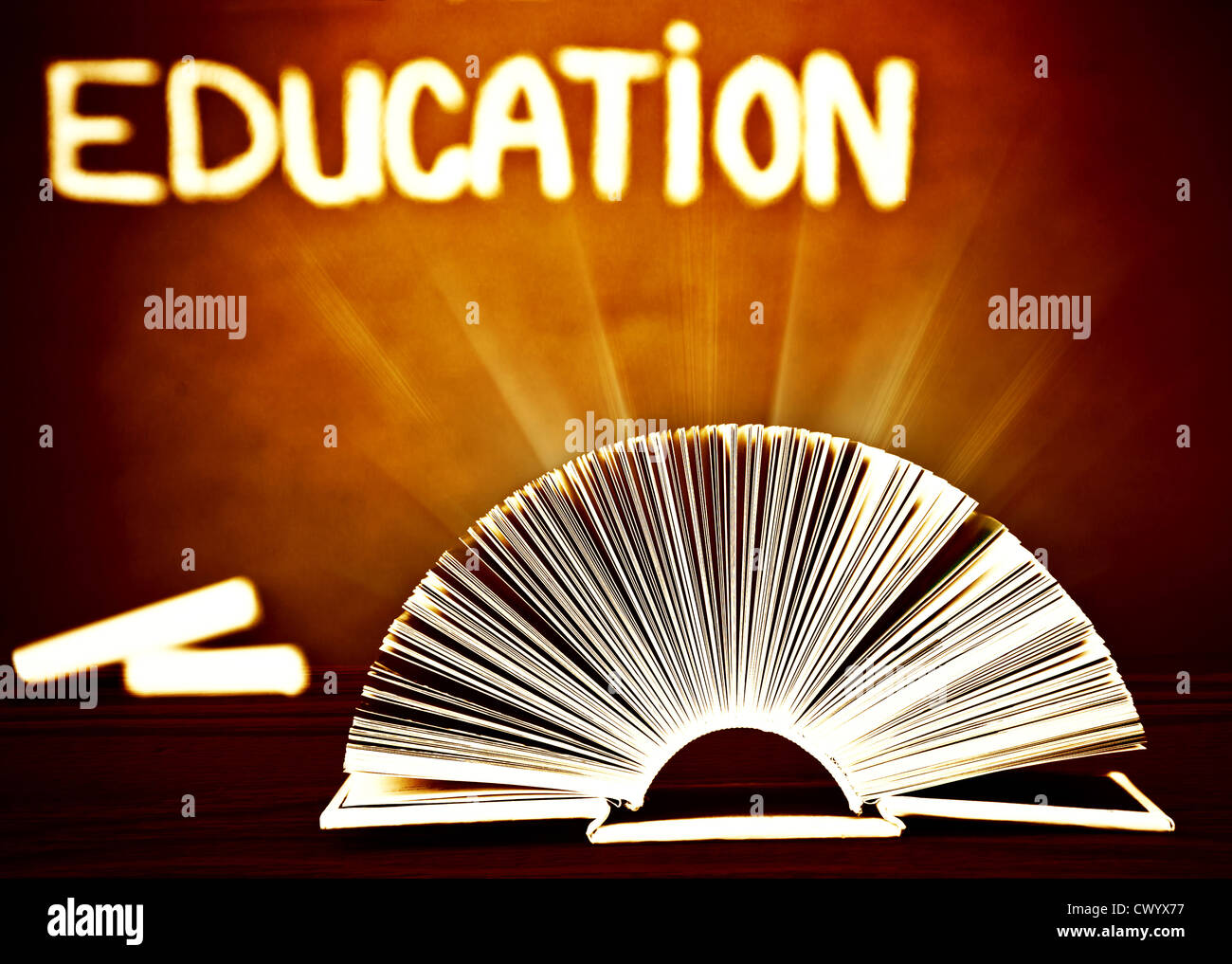 Image of open book on wooden school desk in classroom, textbook over ...