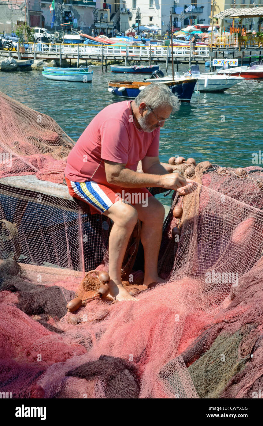Fisherman mending nets hi-res stock photography and images - Alamy