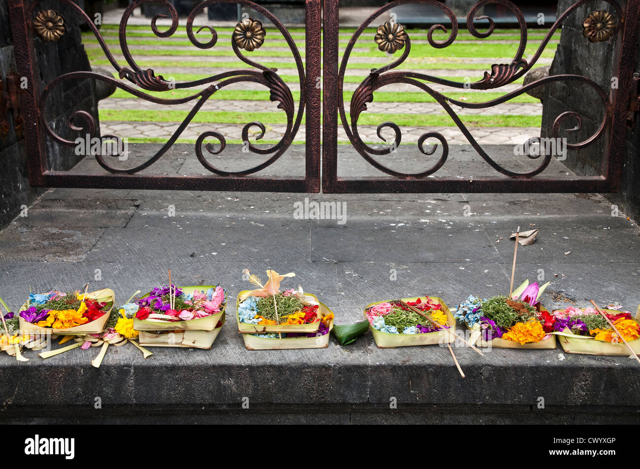 Religious offerings of flowers and food left on the steps of a Hindu ...