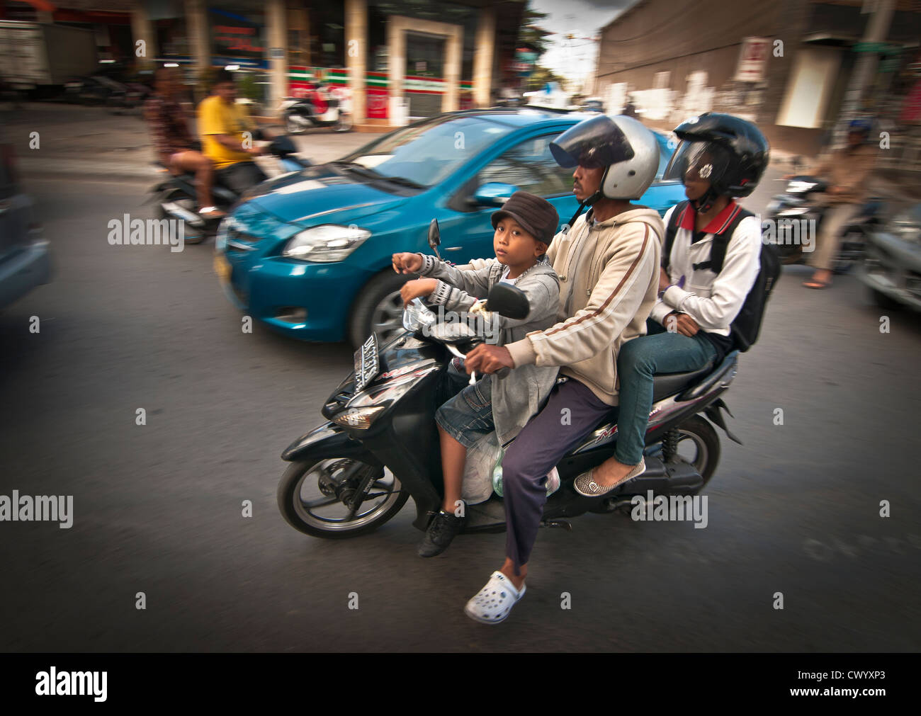 Child on moped asia hi-res stock photography and images - Alamy