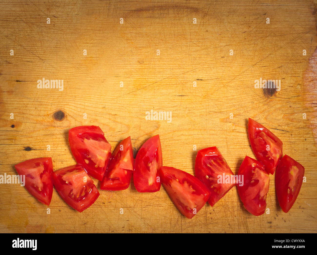 Red tomato slices on chopping board as background Stock Photo - Alamy